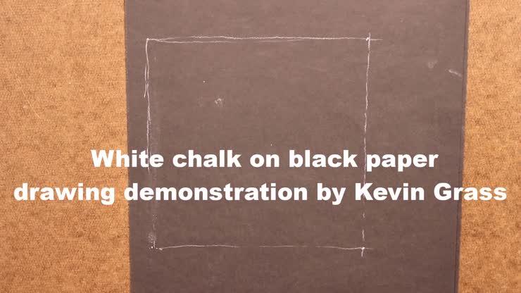 White chalk on black paper drawing demonstration